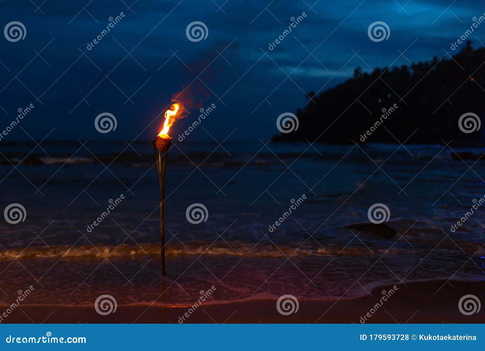 Burning Torch on the Sandy Beach of the Ocean Stock Photo - Image of ...