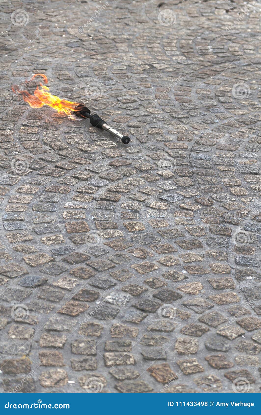 Burning torch on te ground stock photo. Image of night - 111433498