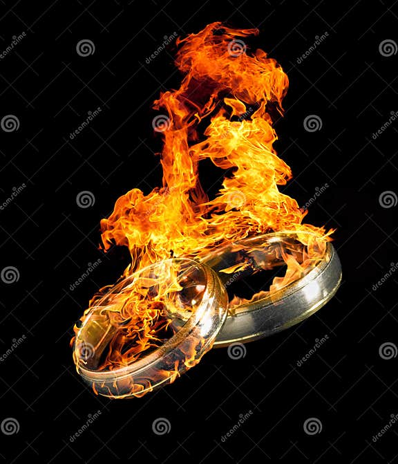 Burning wedding rings stock image. Image of glowing, gold - 65867051