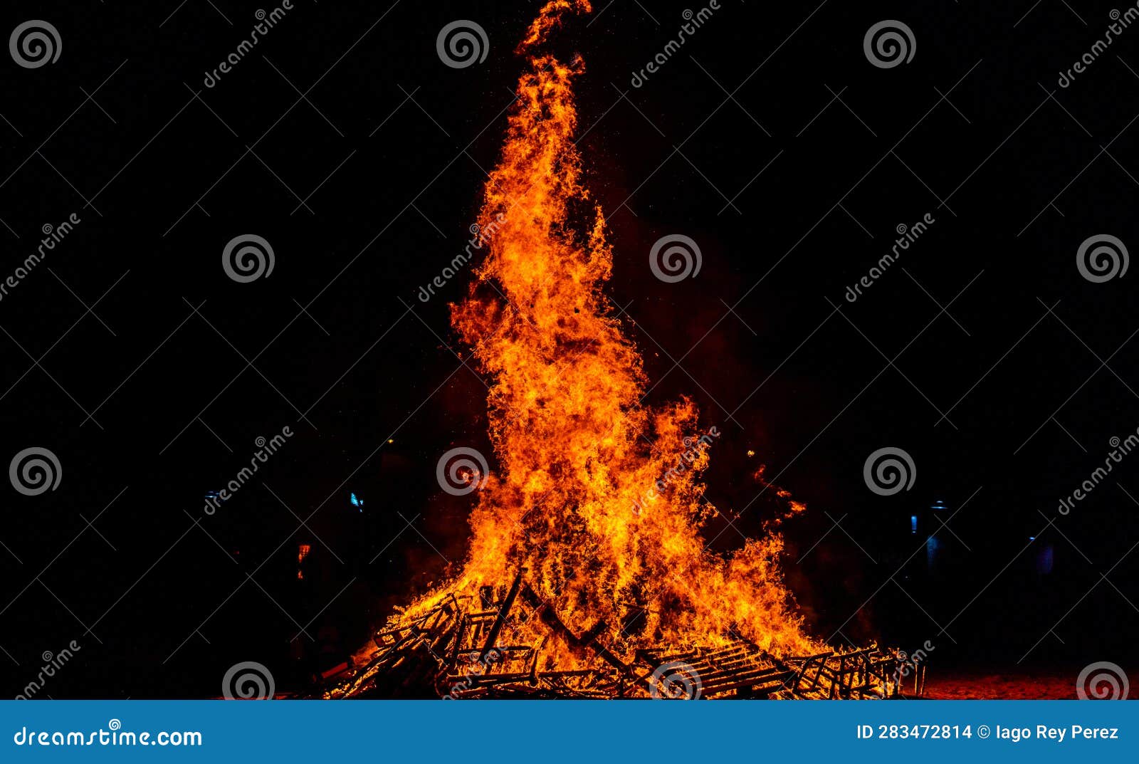 Burning Wood on the Beach Creating Perfect High Flames of Fire Stock ...