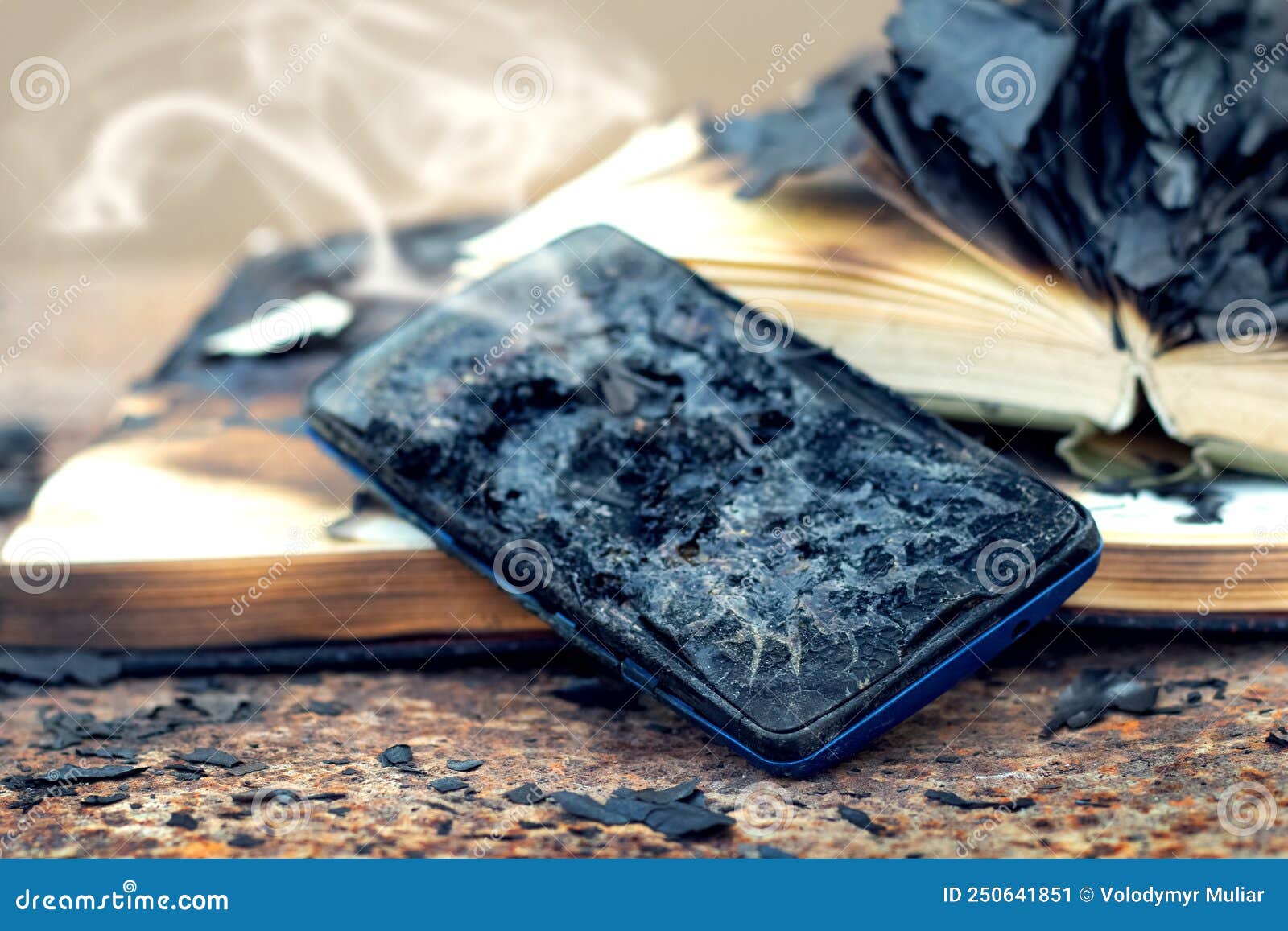 Burnt Books and a Charred Phone in the Office on the Table ...