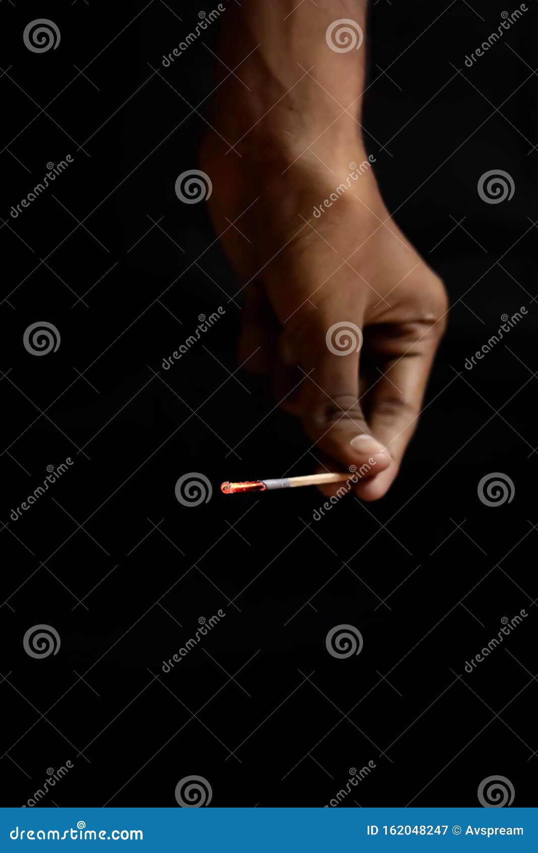 Burnt Extinguished Match Held in Hand on Black Rugged Background. Stock ...