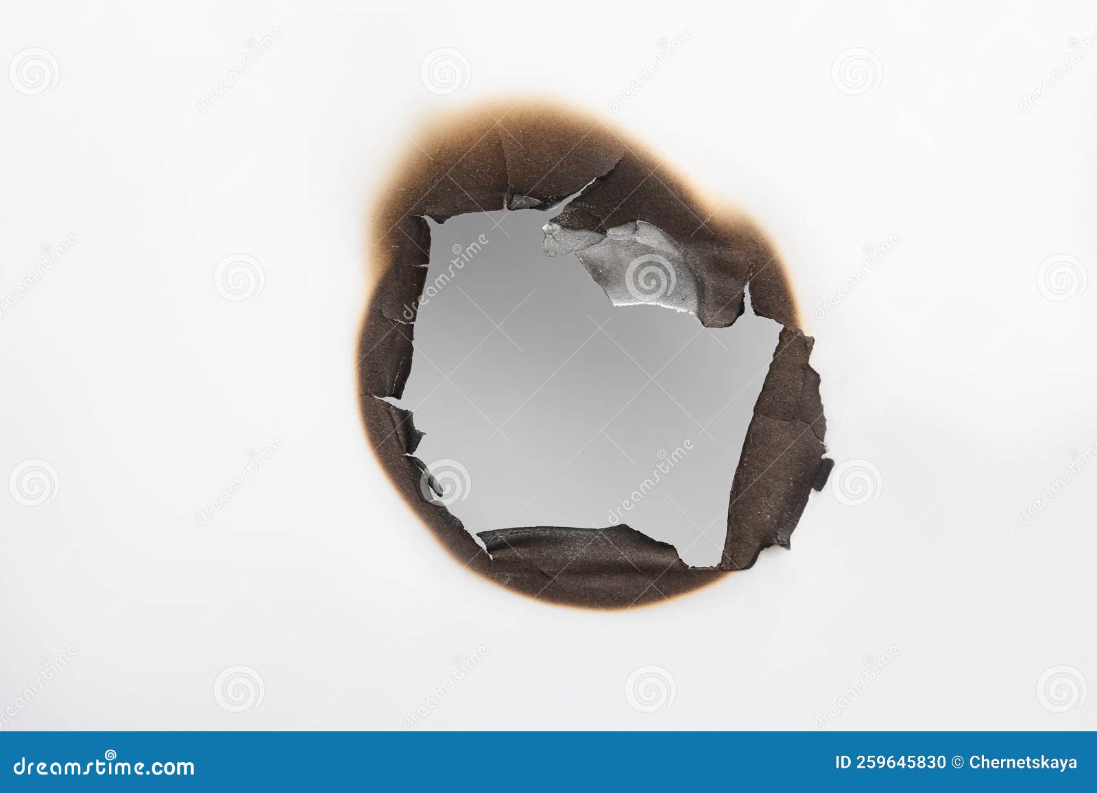 Burnt Hole in Paper on White Background Stock Photo - Image of ...