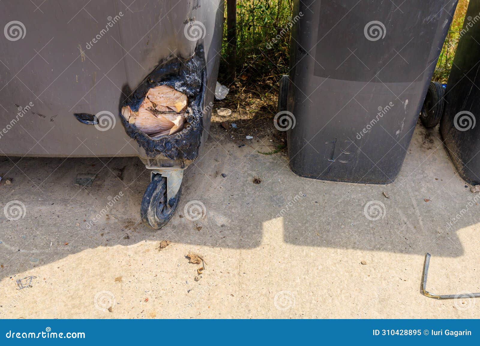 A Burnt Hole in a Plastic Trash Can or Bin. Background with Selective ...