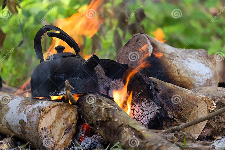 Burnt kettle on campfire stock image. Image of boiling - 69733947