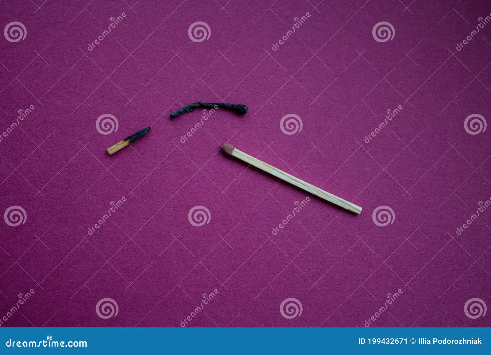 A Burnt Match Broken in Half and Whole Match on Purple Background Stock ...
