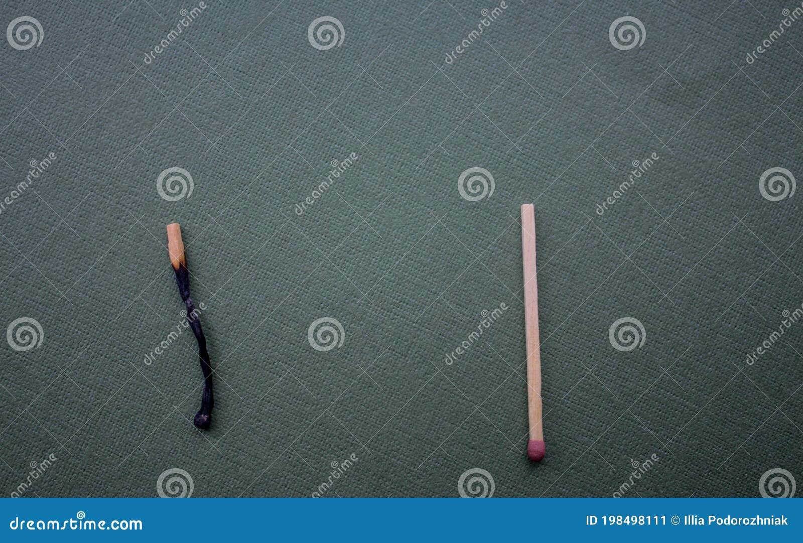 A Burnt Match and Whole Match on Green Background Stock Image - Image ...