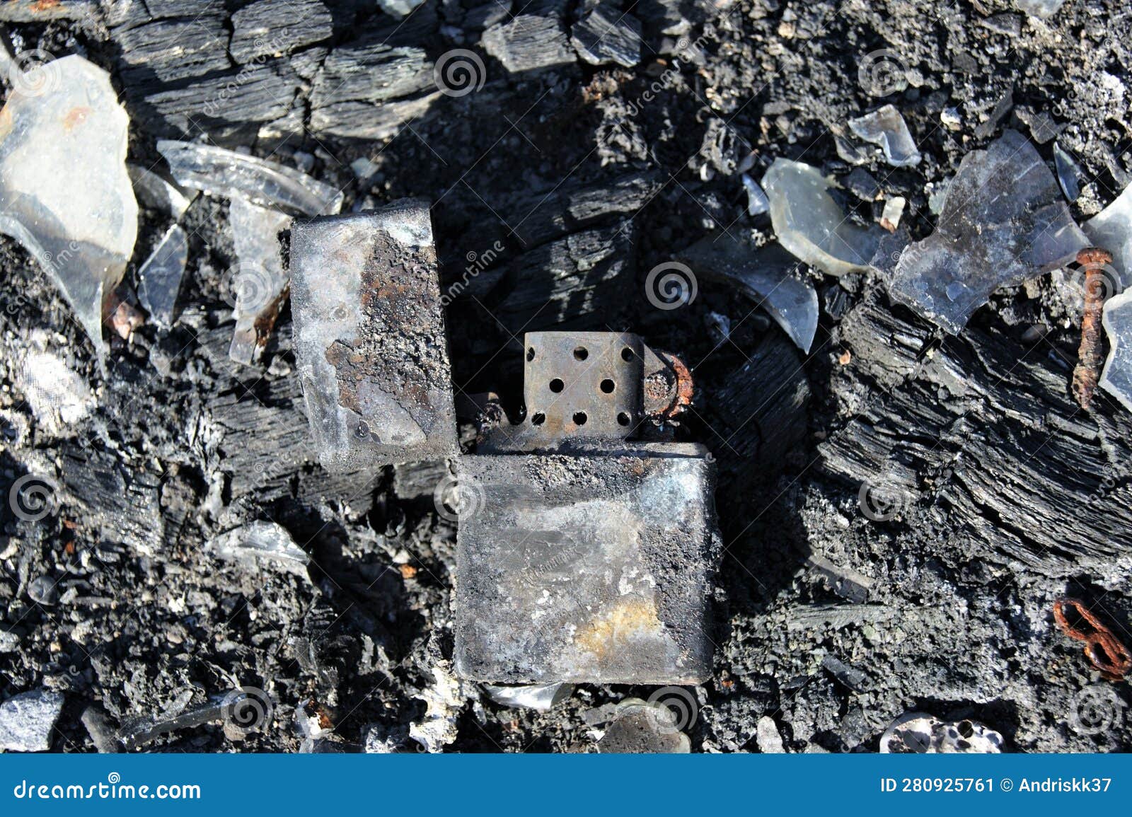 Burnt Metal Lighter in Ashes. Consequences of the Fire. Close-up. Stock ...