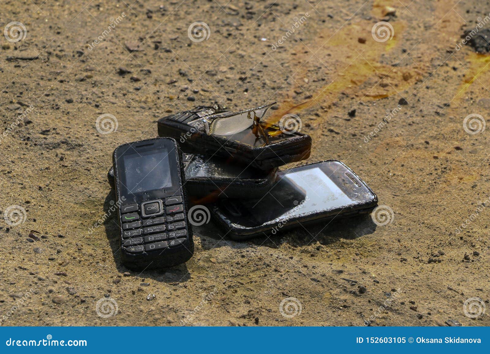 Burnt Mobile Phones on Textural Concrete Background. Concept: Danger of ...