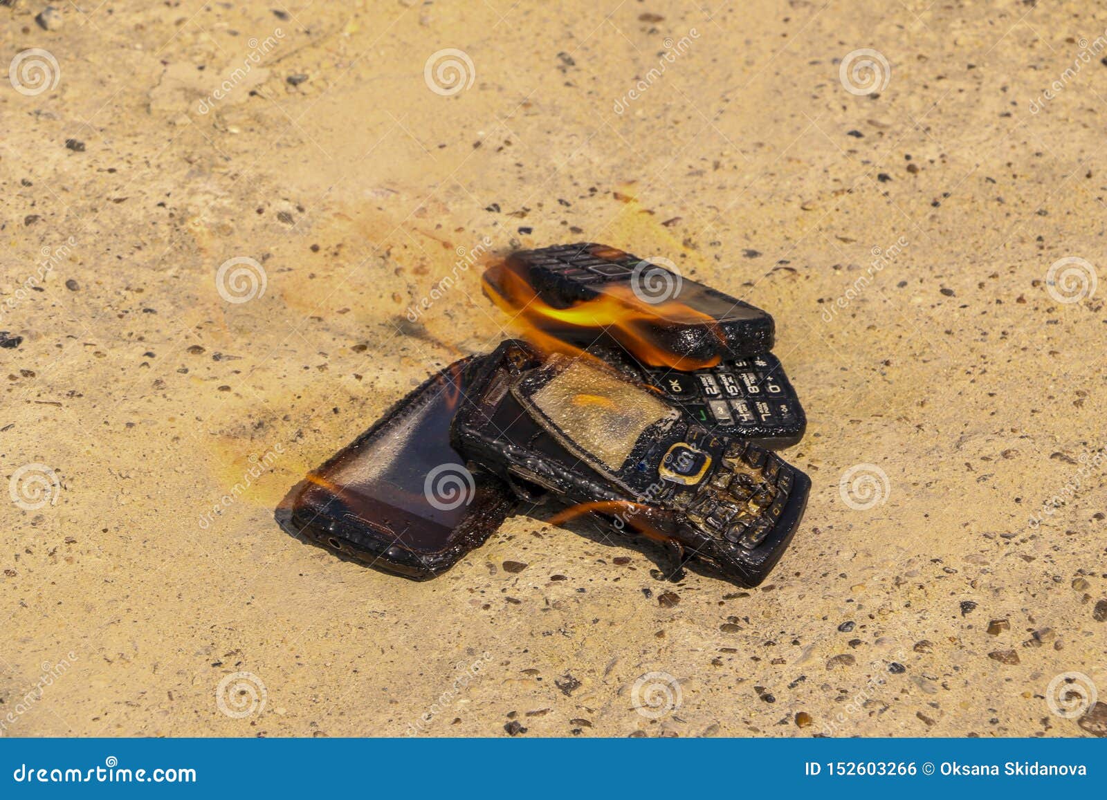 Burnt Mobile Phones on Textural Concrete Background. Concept: Danger of ...