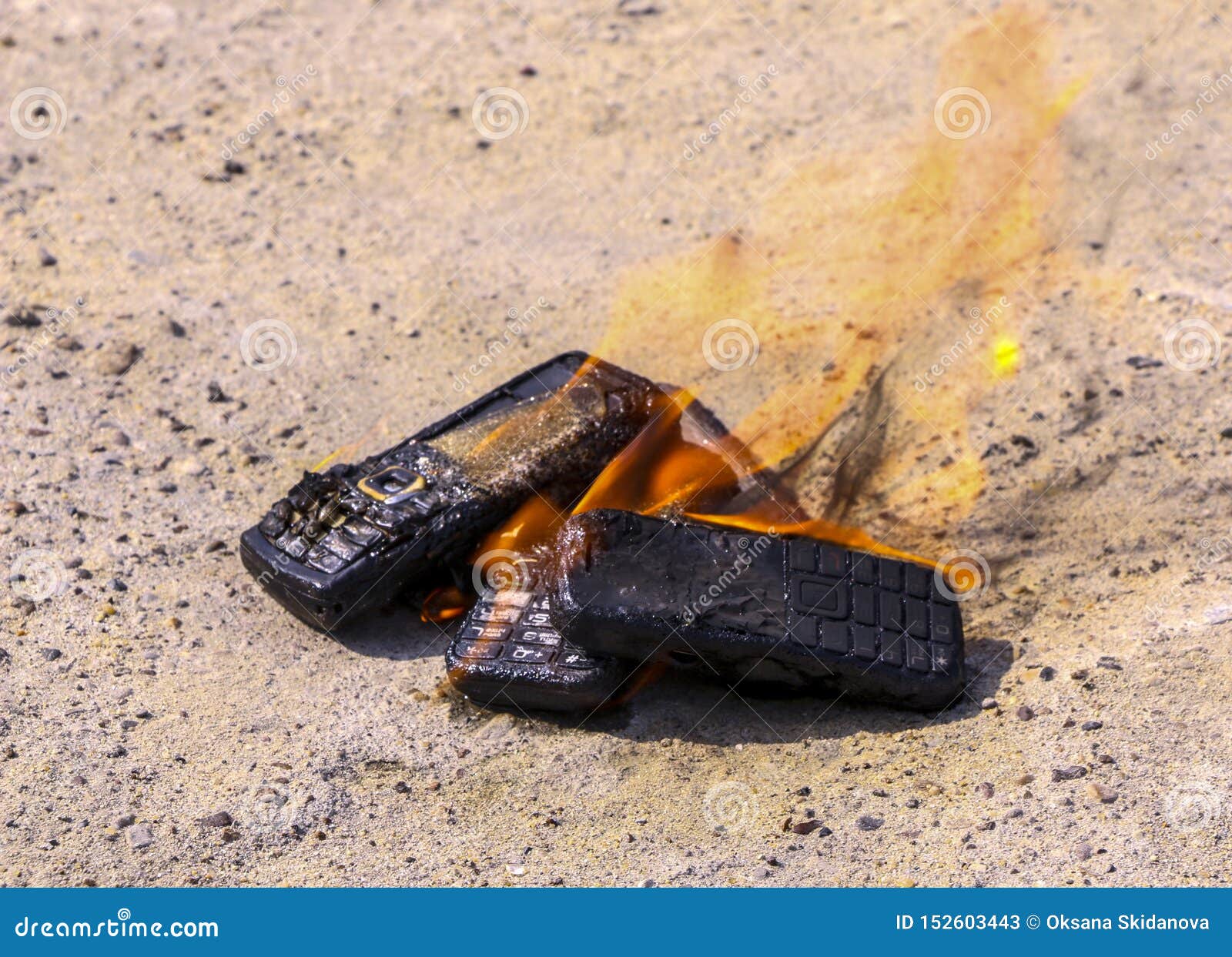 Burnt Mobile Phones on Textural Concrete Background. Concept: Danger of ...