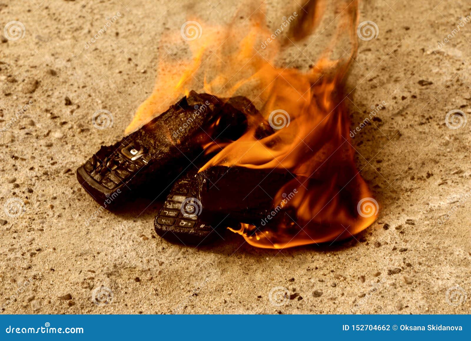Burnt Mobile Phones on Textural Concrete Background. Concept: Danger of ...