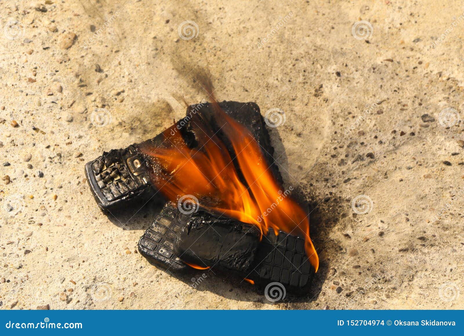 Burnt Mobile Phones on Textural Concrete Background. Concept: Danger of ...