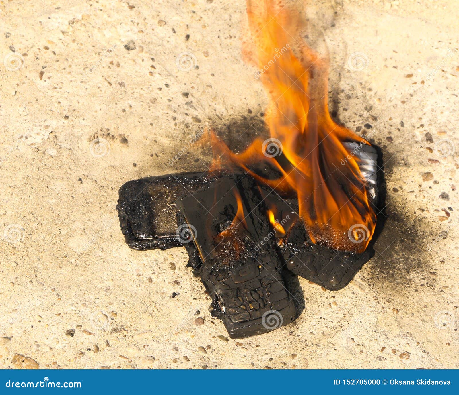 Burnt Mobile Phones on Textural Concrete Background. Concept: Danger of ...