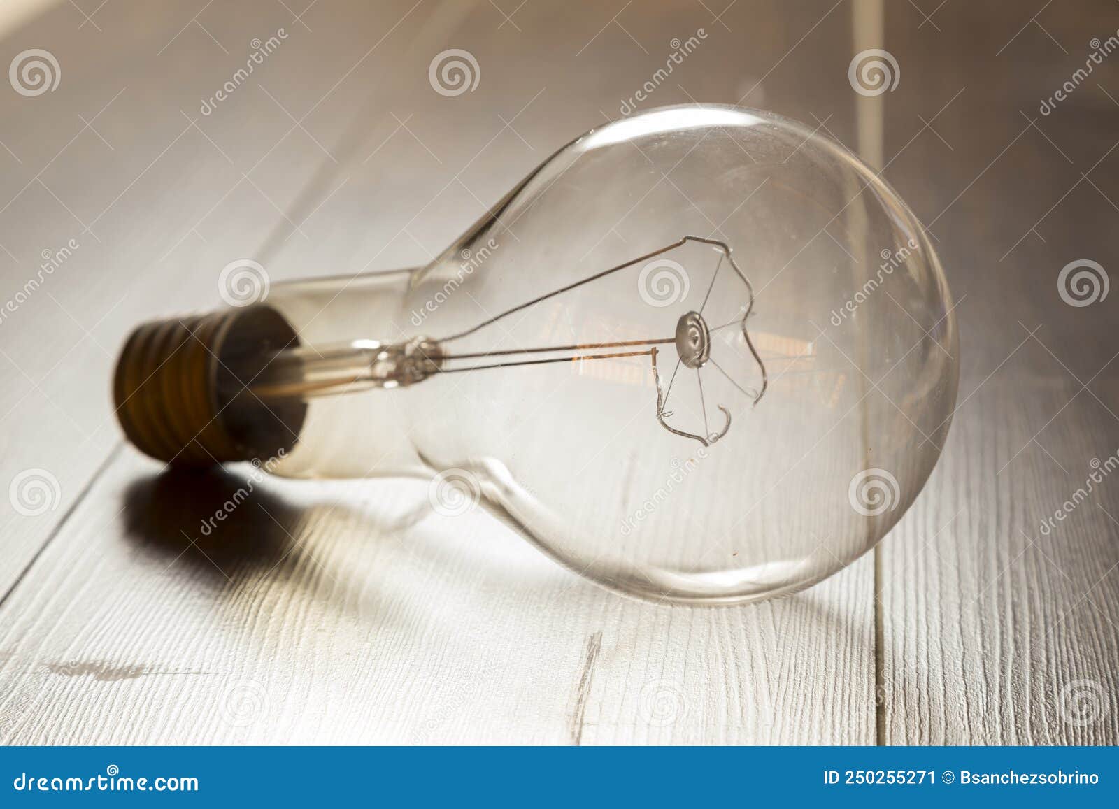 Burnt Out Light Bulb on Wooden Surface Stock Image - Image of glass ...