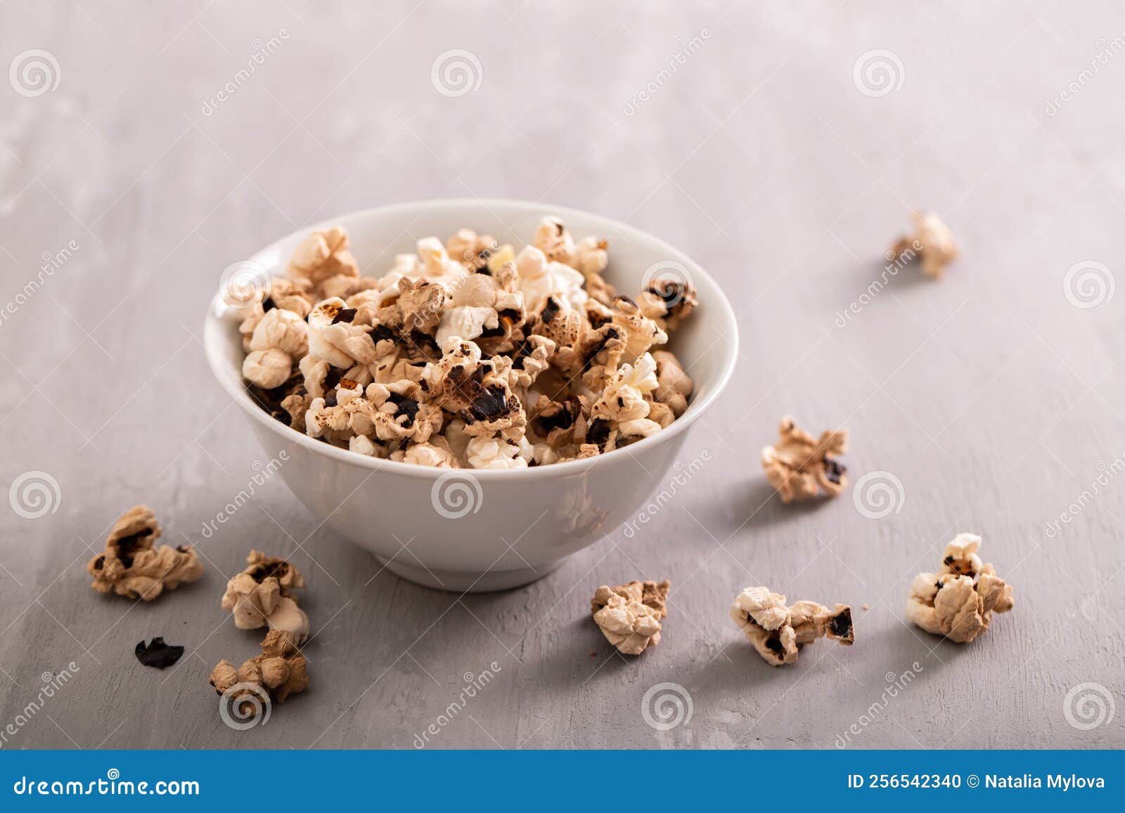 Burnt Popcorn in the Small White Bowl on Ceramic Stock Photo - Image of ...