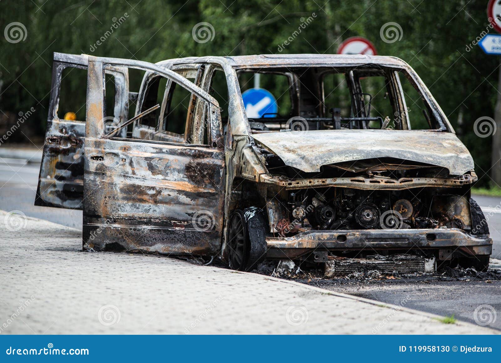 Burnt rusty car on road. stock photo. Image of vandalism - 119958130