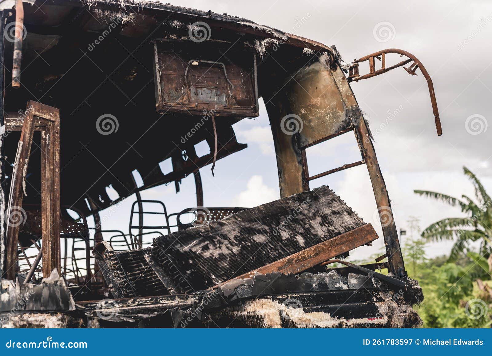 A Burnt and Totaled Bus Destroyed by Fire Abandoned at an Empty Lot ...