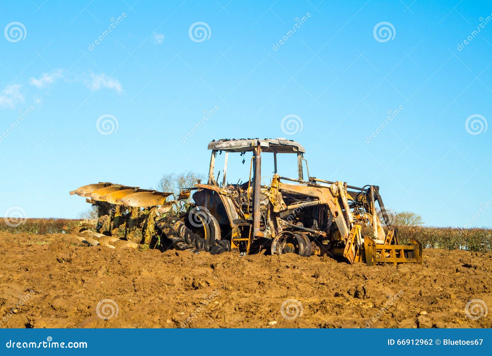 Burnt Tractor Digger in Ploughed Field Stock Photo - Image of plough ...