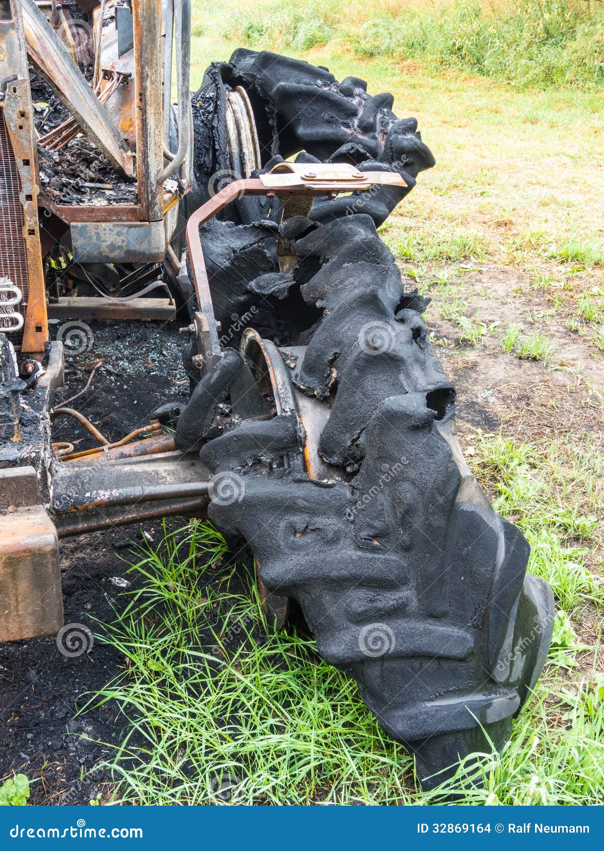 Burnt wheel of tractor stock photo. Image of bonnet, meadow - 32869164