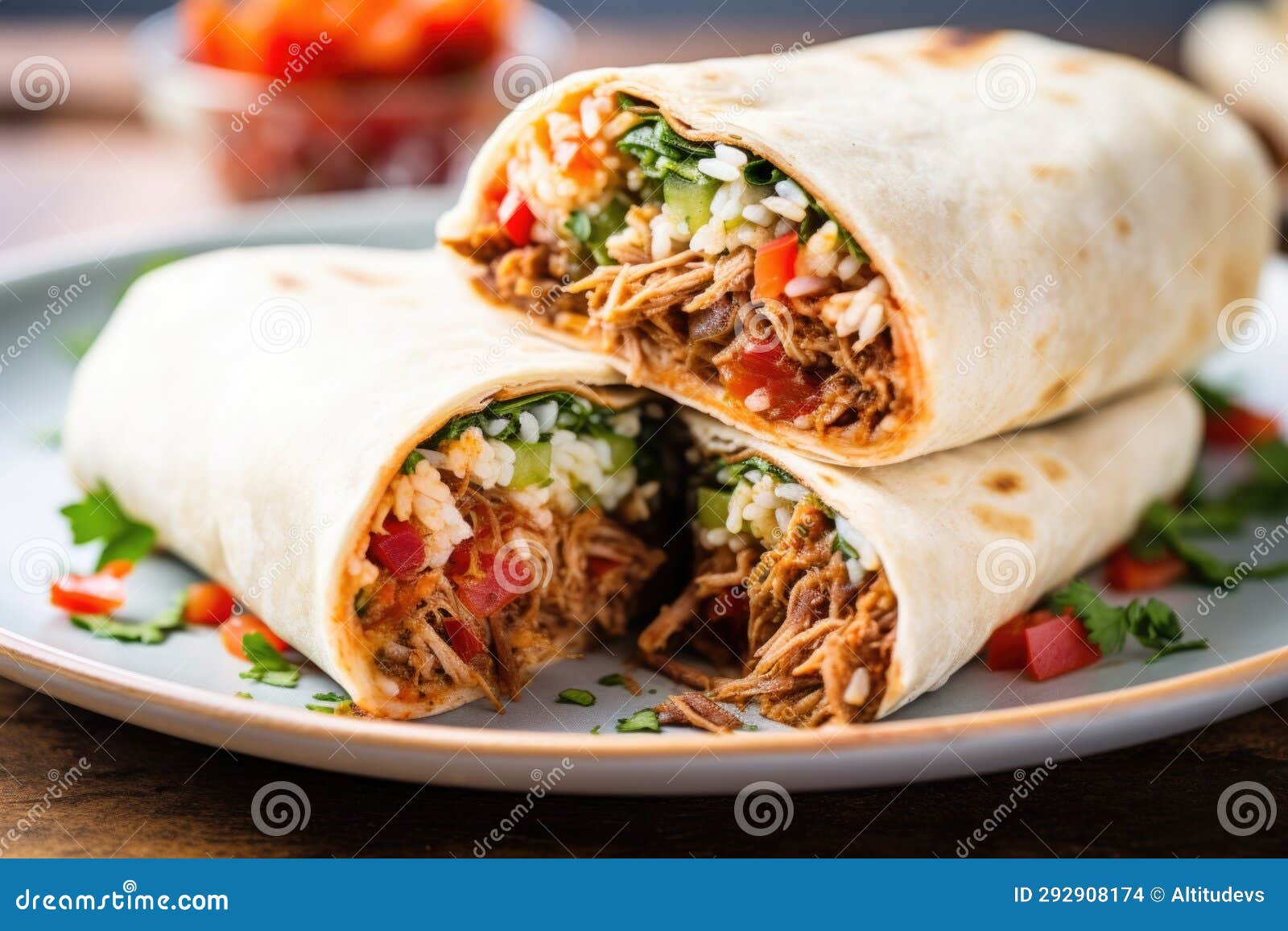 Burrito Cut Open with Filling Spilling Over Onto the Plate Stock Photo ...