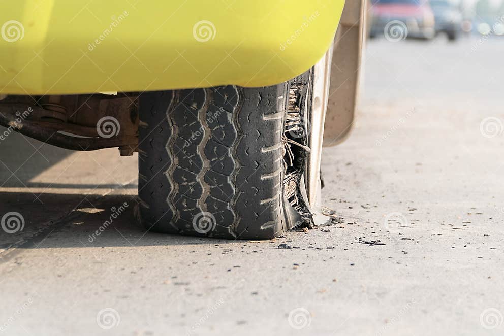 Burst tire on the road stock photo. Image of accident - 165562184