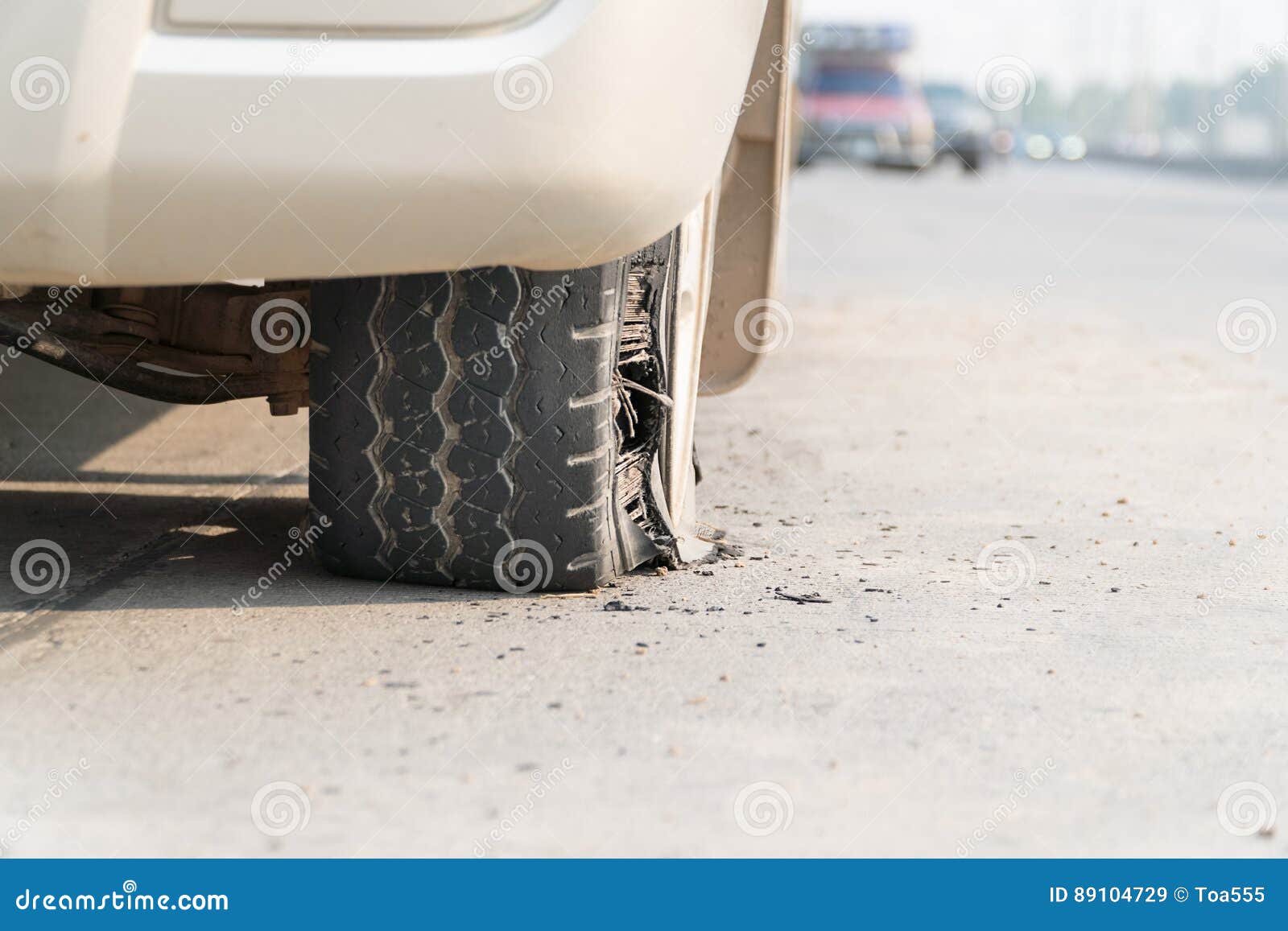 Burst tire on the road stock image. Image of hole, close - 89104729