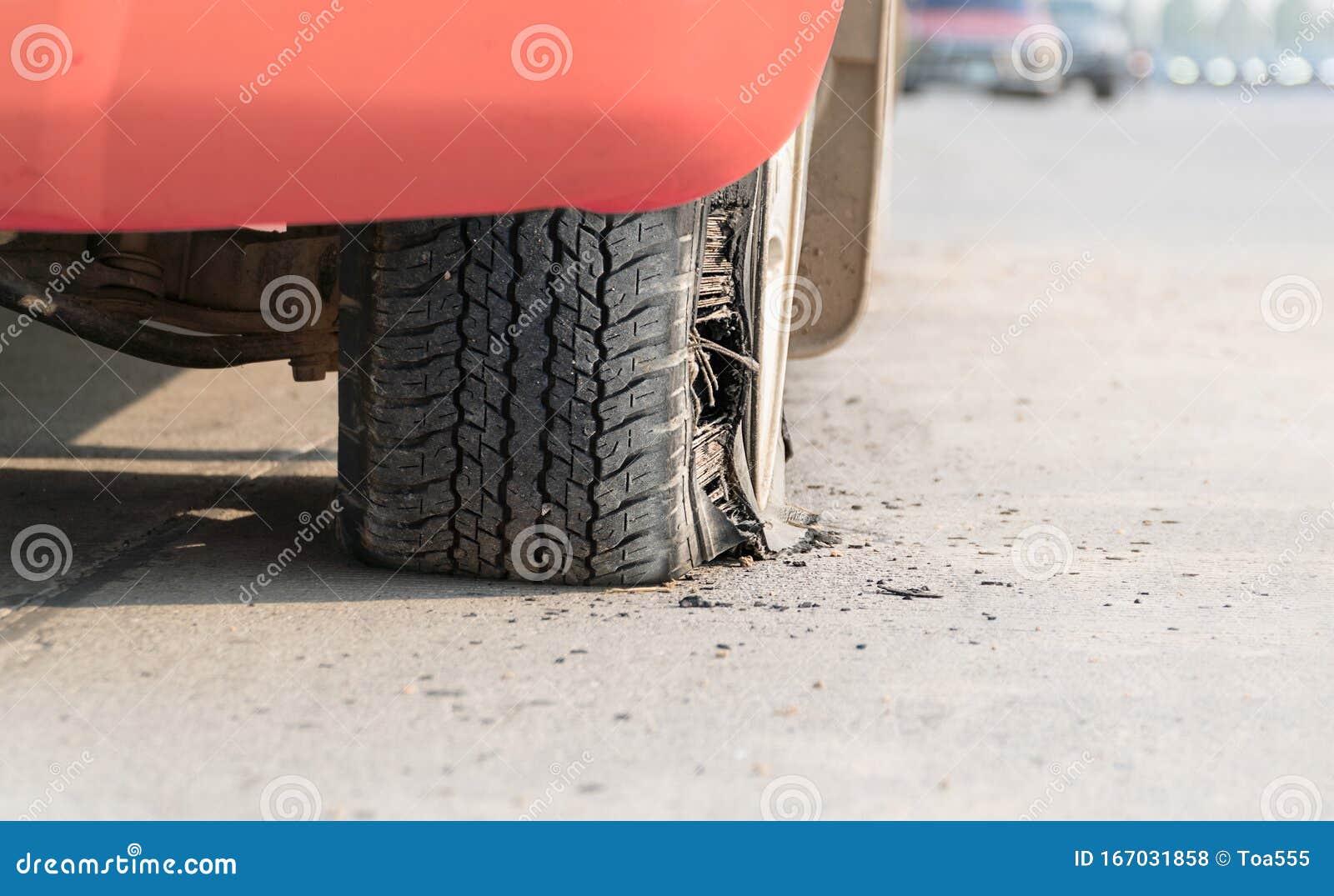 Burst tire on the road stock photo. Image of closeup - 167031858