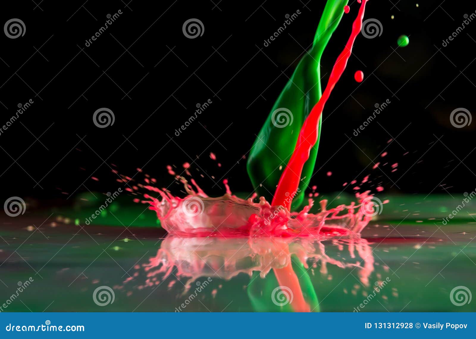 Bursts and Splashes from Falling Paints of Different Colors Stock Photo ...