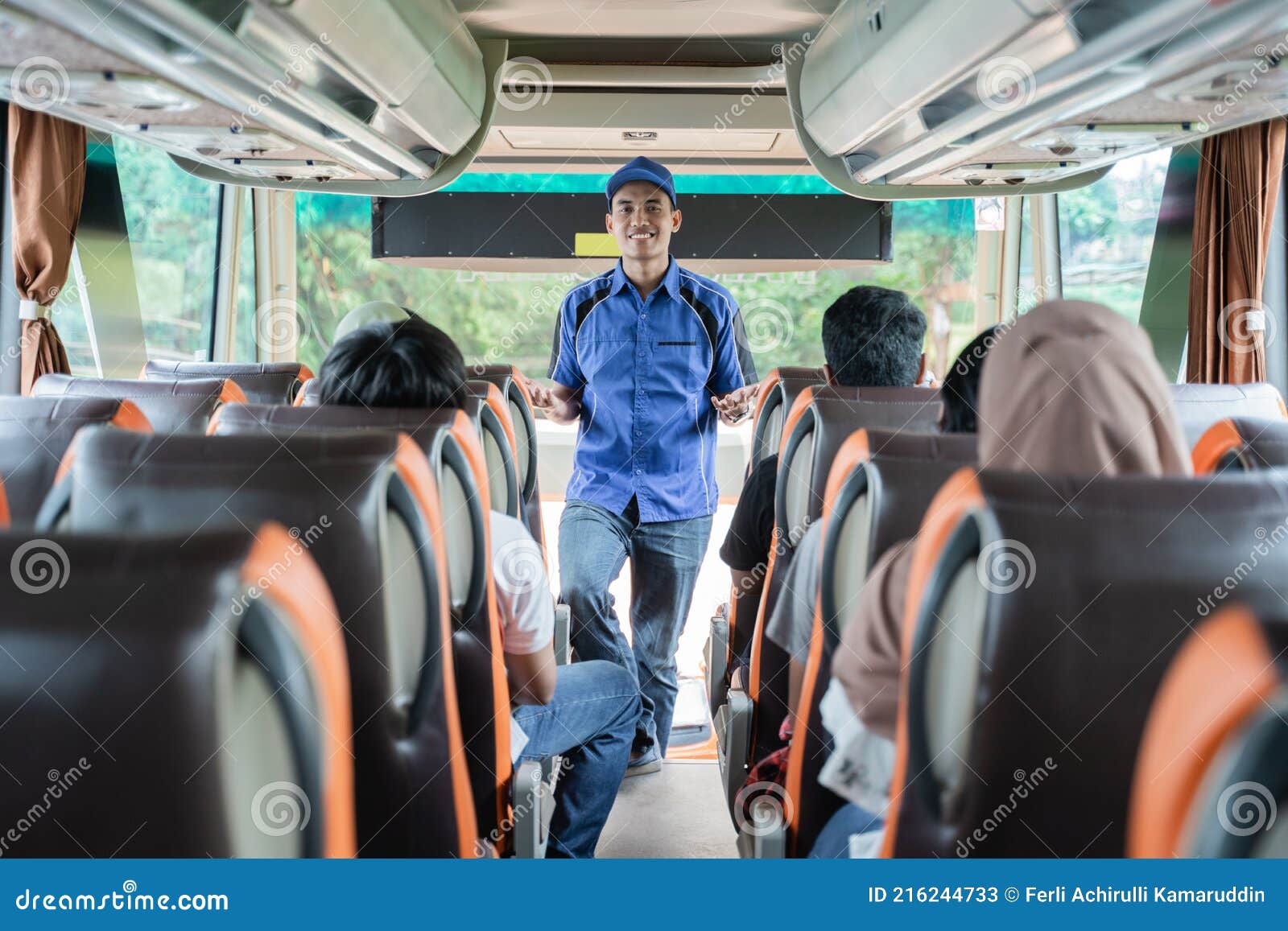 A Bus Crew in Uniform and a Hat Briefs the Passengers Stock Image ...