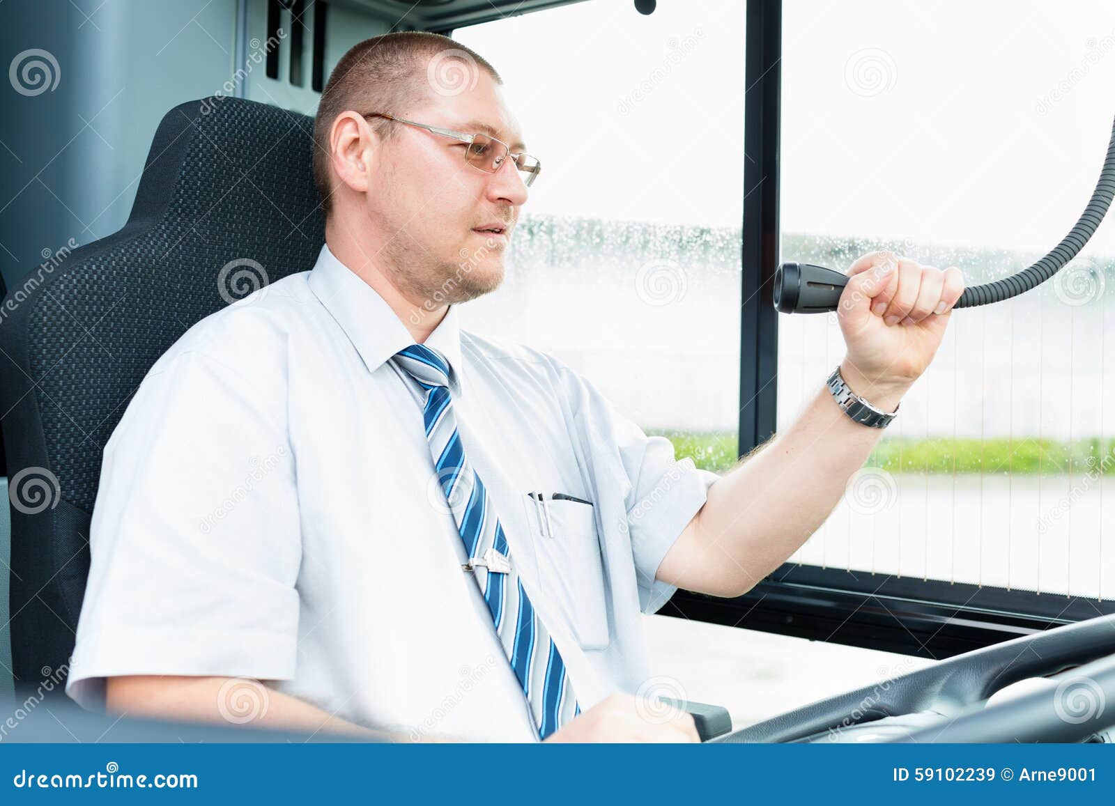 Bus Driver Making Announcement Using Microphone Stock Image - Image of ...