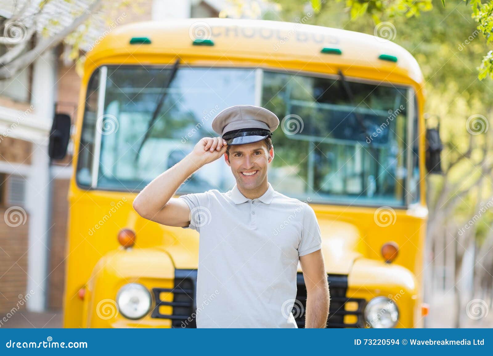 Bus Driver Smiling in Front of Bus Stock Photo - Image of looking ...