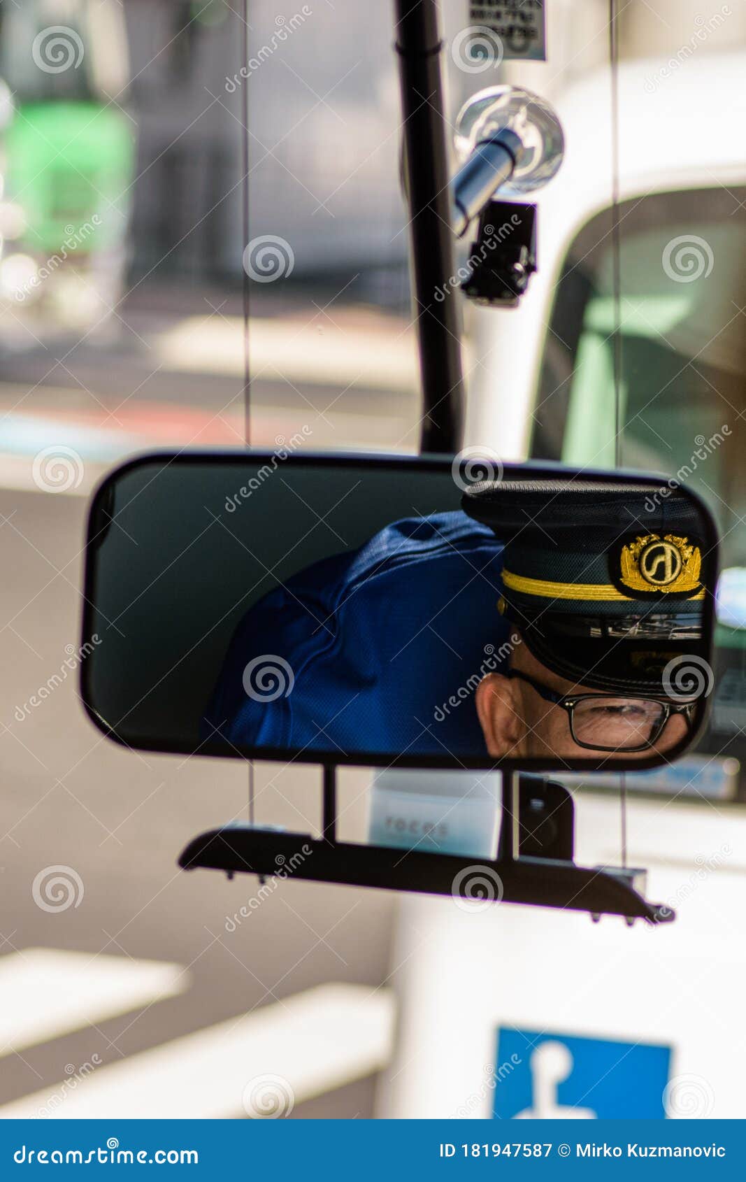 Bus Driver Taking a Look in the Rear View Mirror, Hiroshima, Japan ...