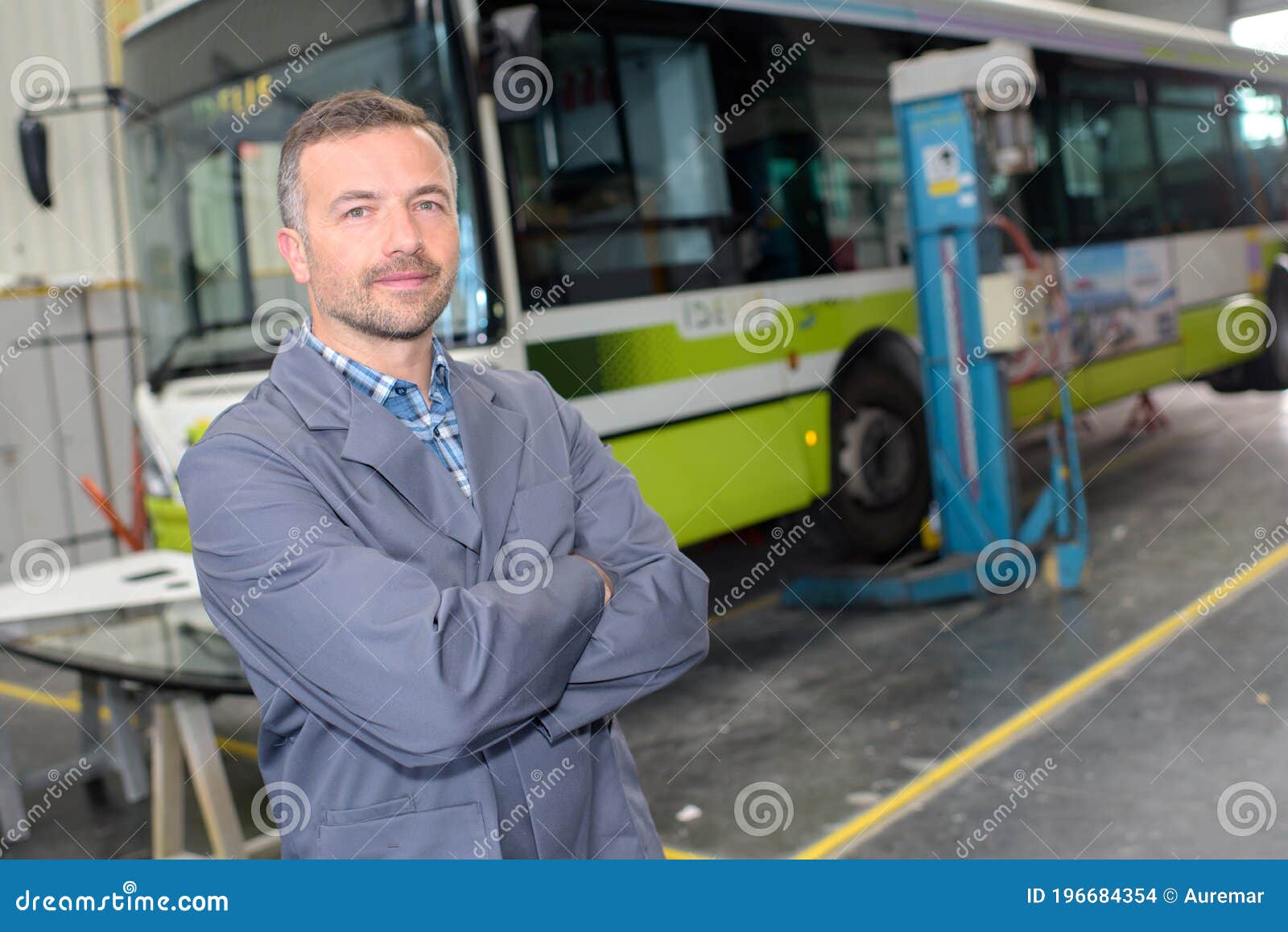 Bus mechanic posing stock photo. Image of passenger - 196684354