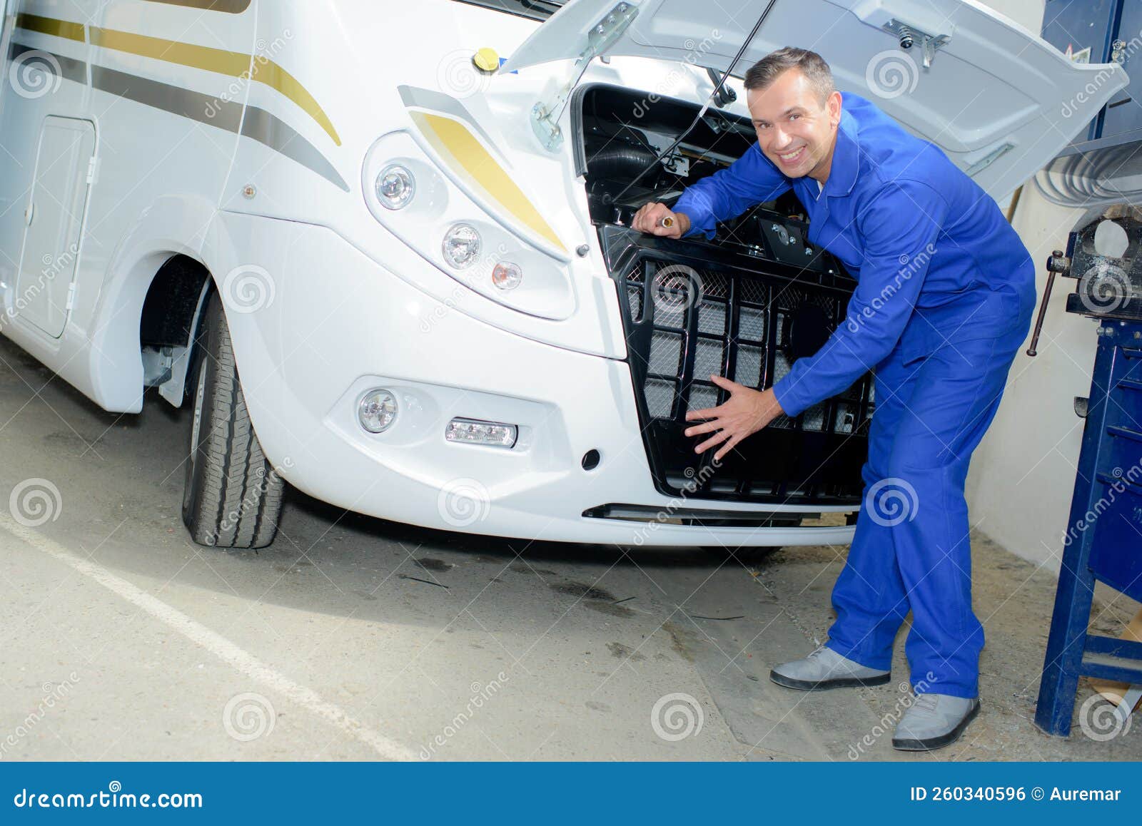 Bus mechanic at work stock photo. Image of install, garage - 260340596