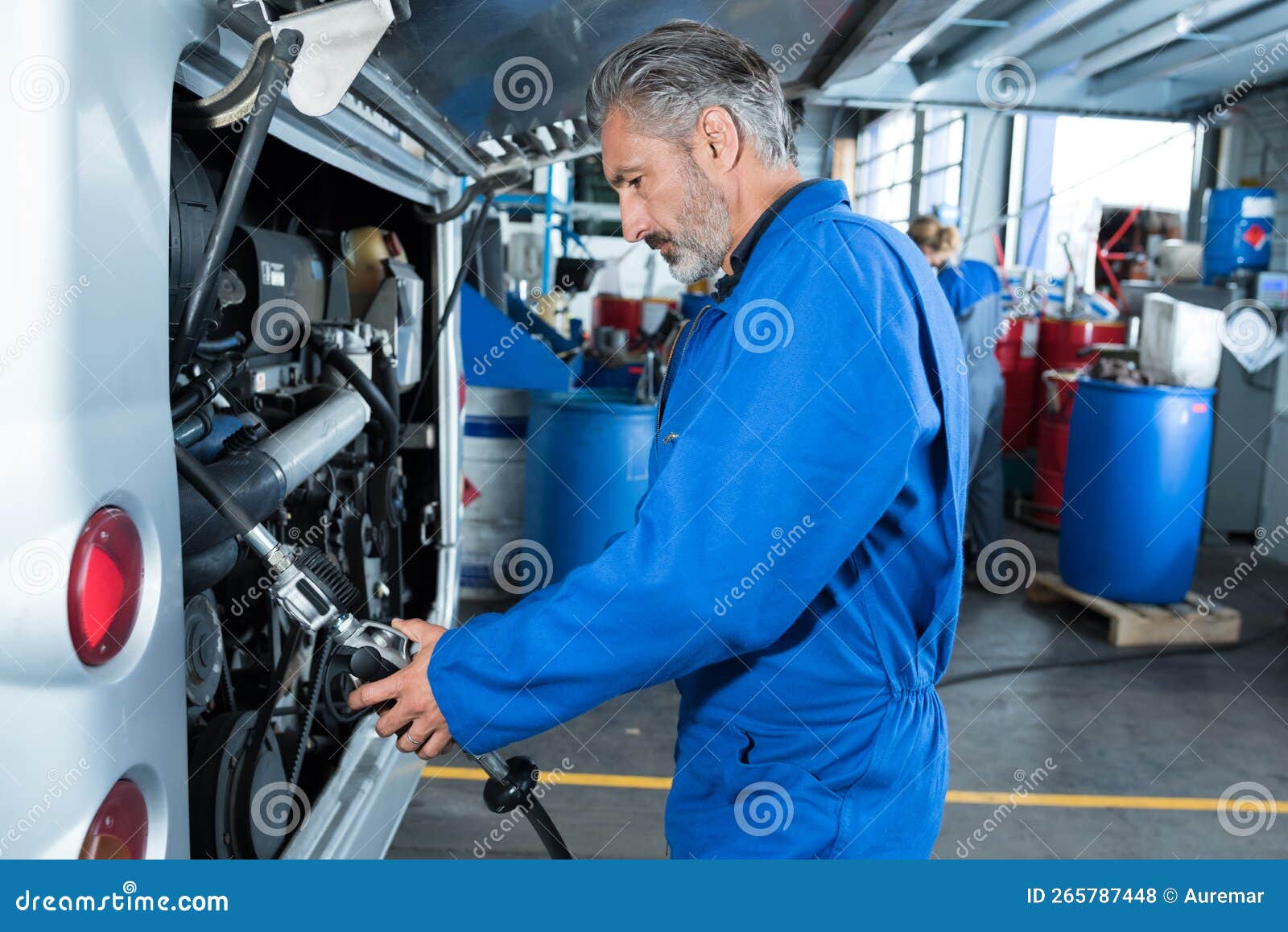 Bus mechanic at work stock photo. Image of repair, detail - 265787448