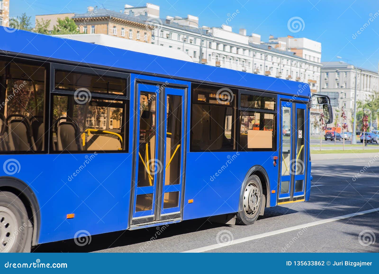 Bus moving down the street stock photo. Image of coach - 135633862