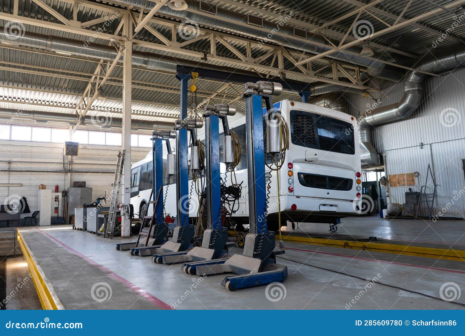 Bus repair in car service stock photo. Image of inspection - 285609780