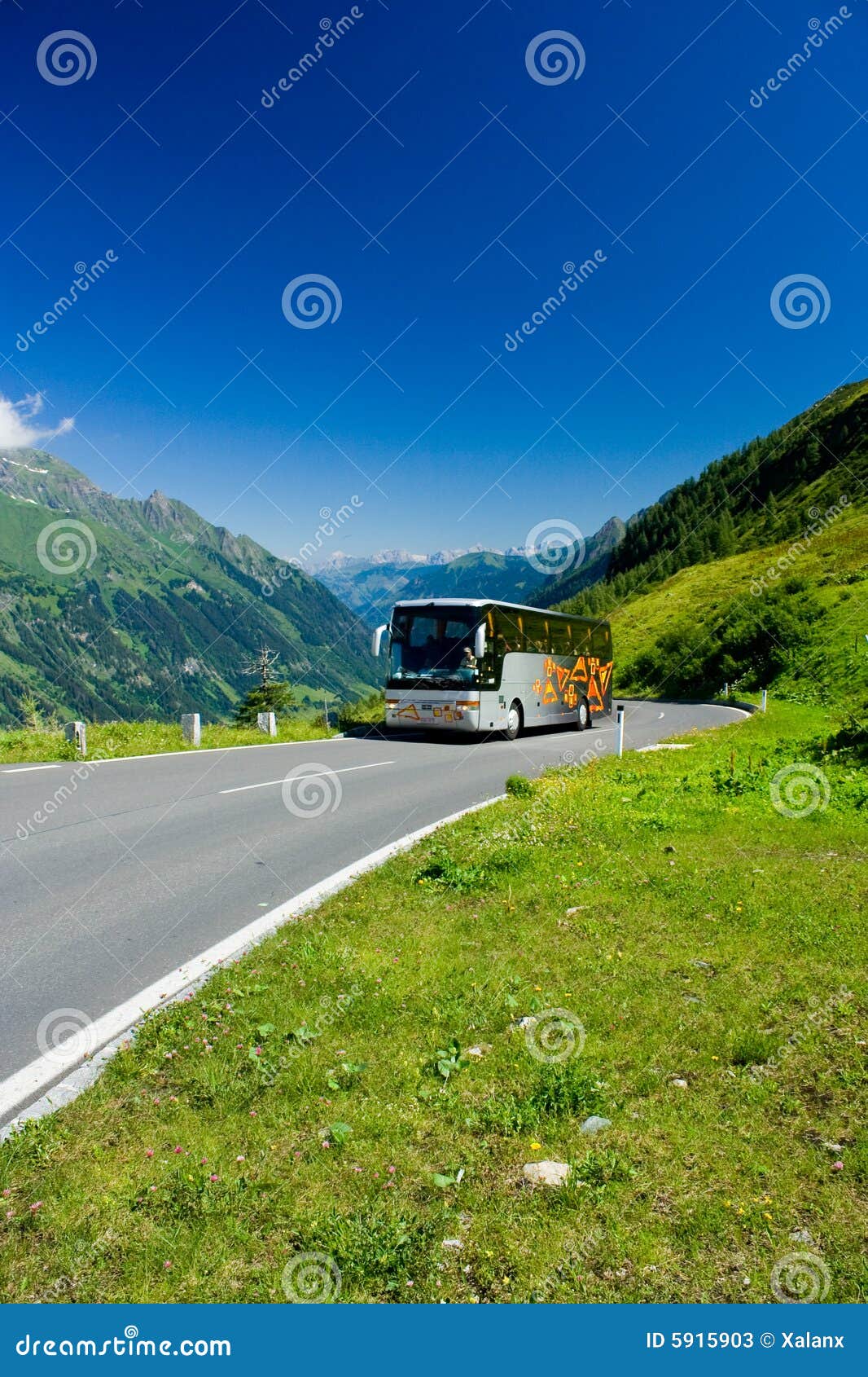 Bus on a road in Alps stock image. Image of metal, orange - 5915903