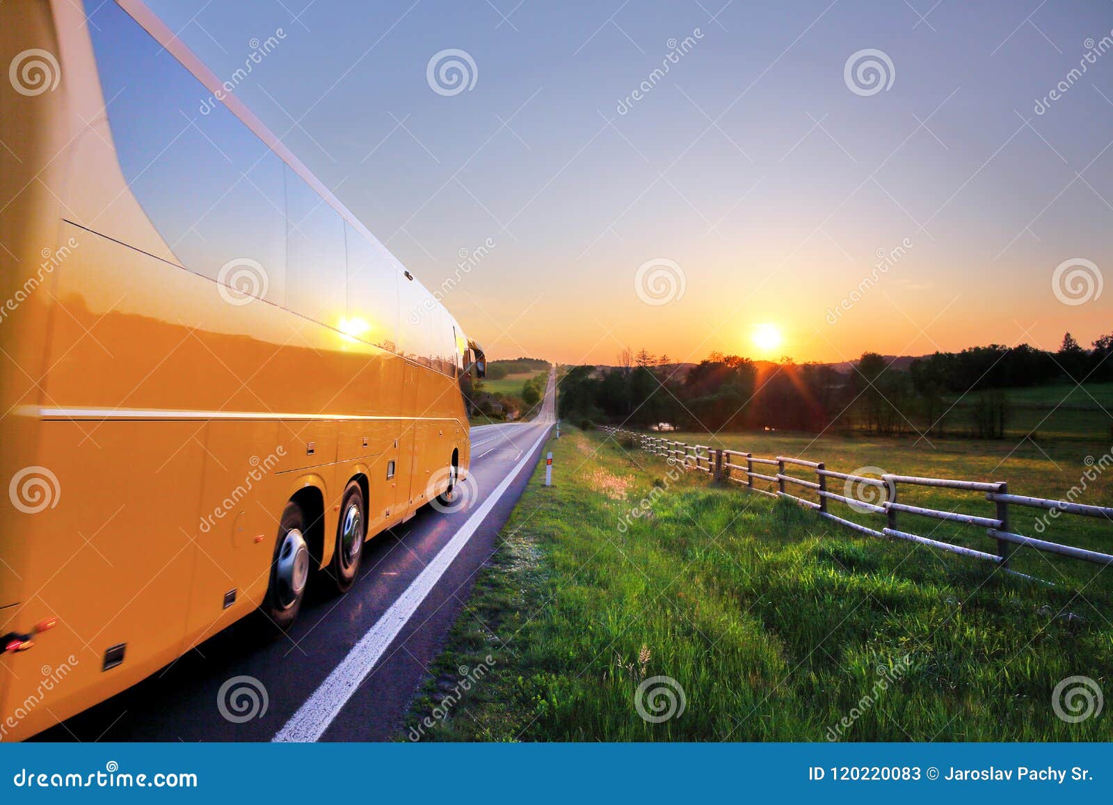 Bus on the road at sunset stock image. Image of driver - 120220083