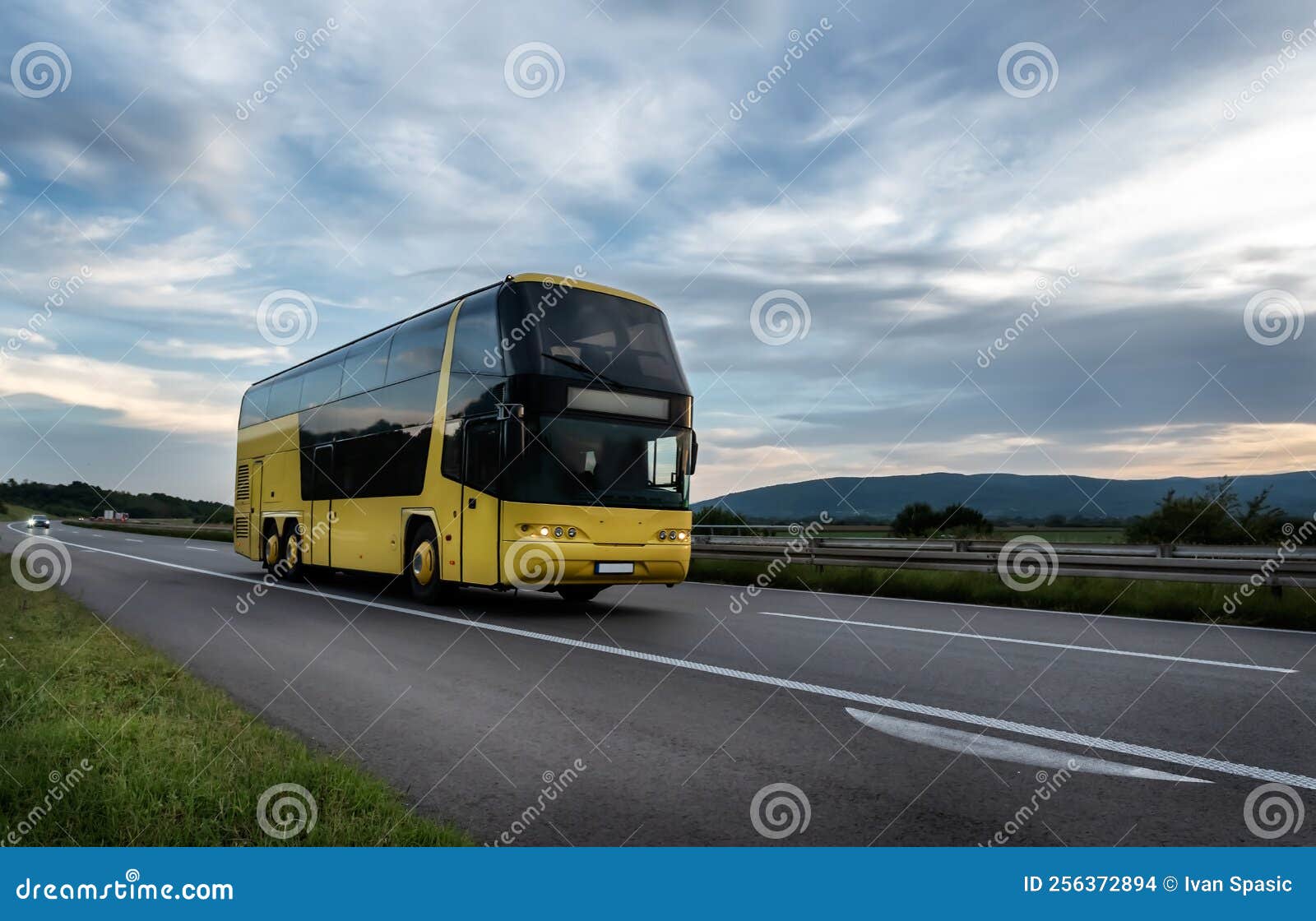 Bus on the road stock photo. Image of tram, clouds, asphalt - 256372894