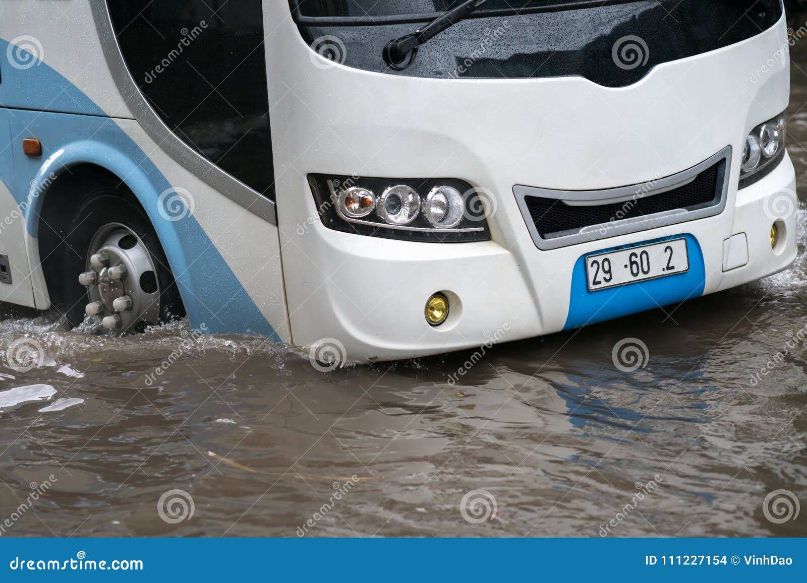 Bus Splashes through a Large Puddle on a Flooded Street Editorial Stock ...
