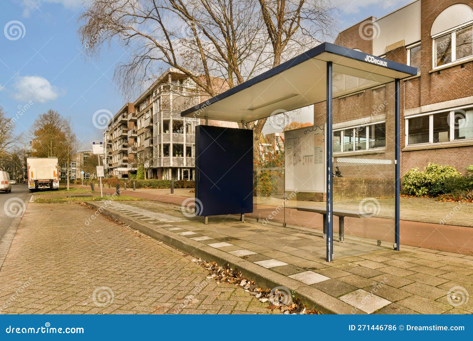 A Bus Stop on the Side of a Street Stock Photo - Image of construction ...