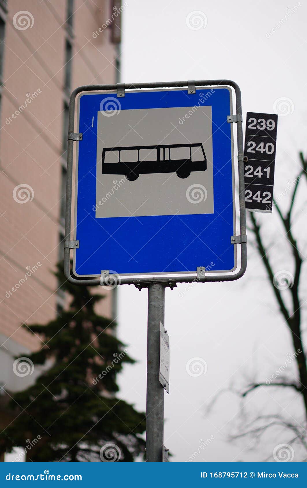 Bus Stop Sign on a Post in the City. Stock Photo - Image of post, sign ...
