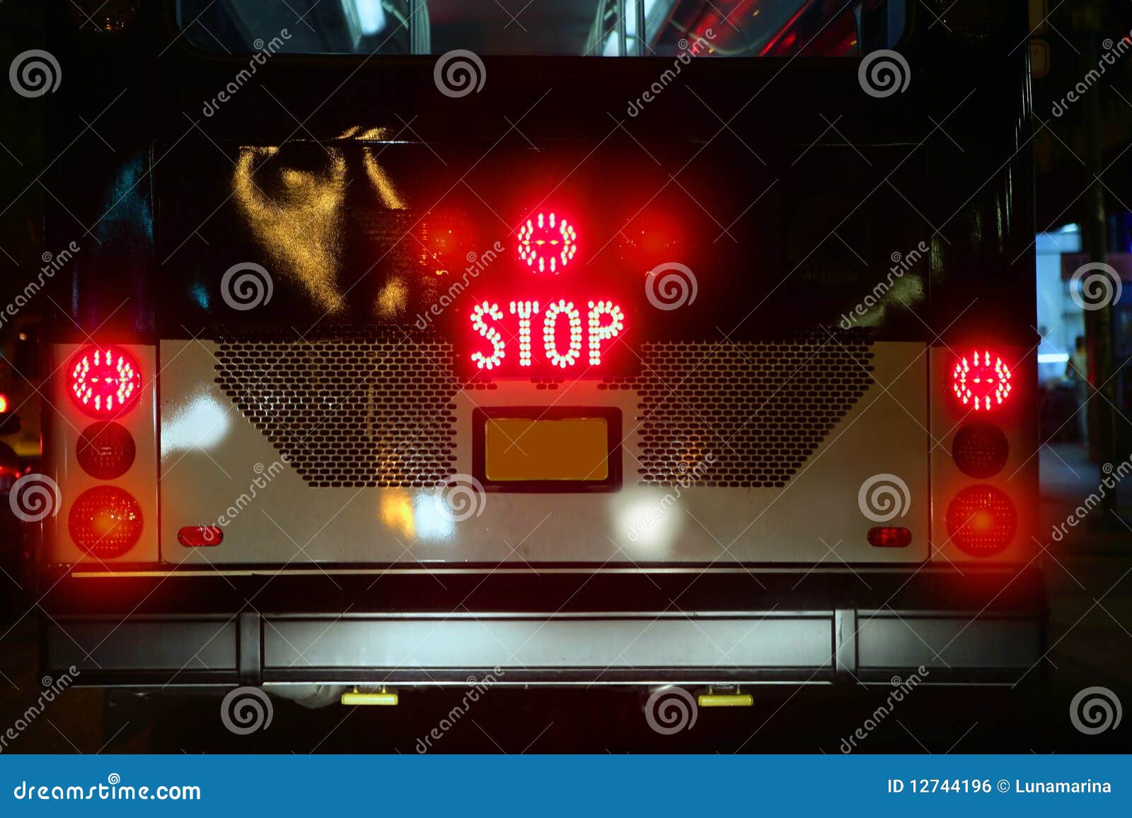 Bus Stop Signal Glowing with Traffic Lights Stock Photo - Image of ...