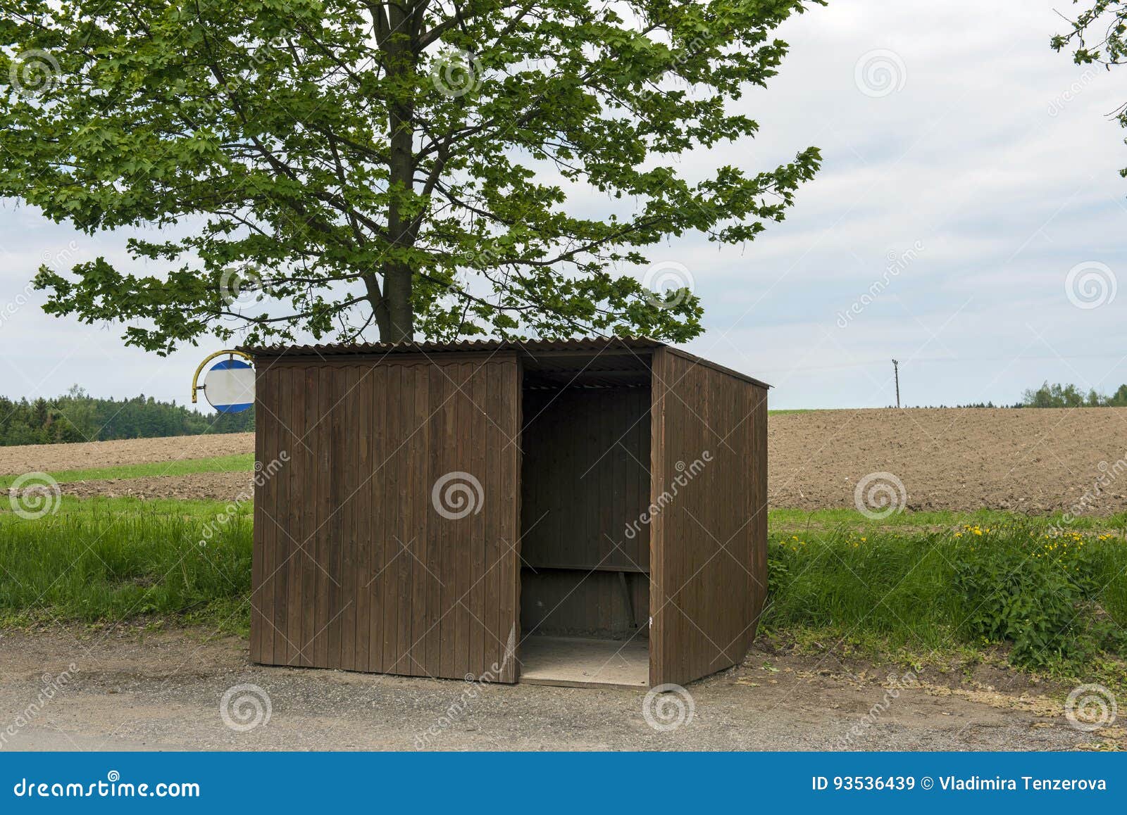 Bus stop under the tree stock image. Image of cloud, green - 93536439