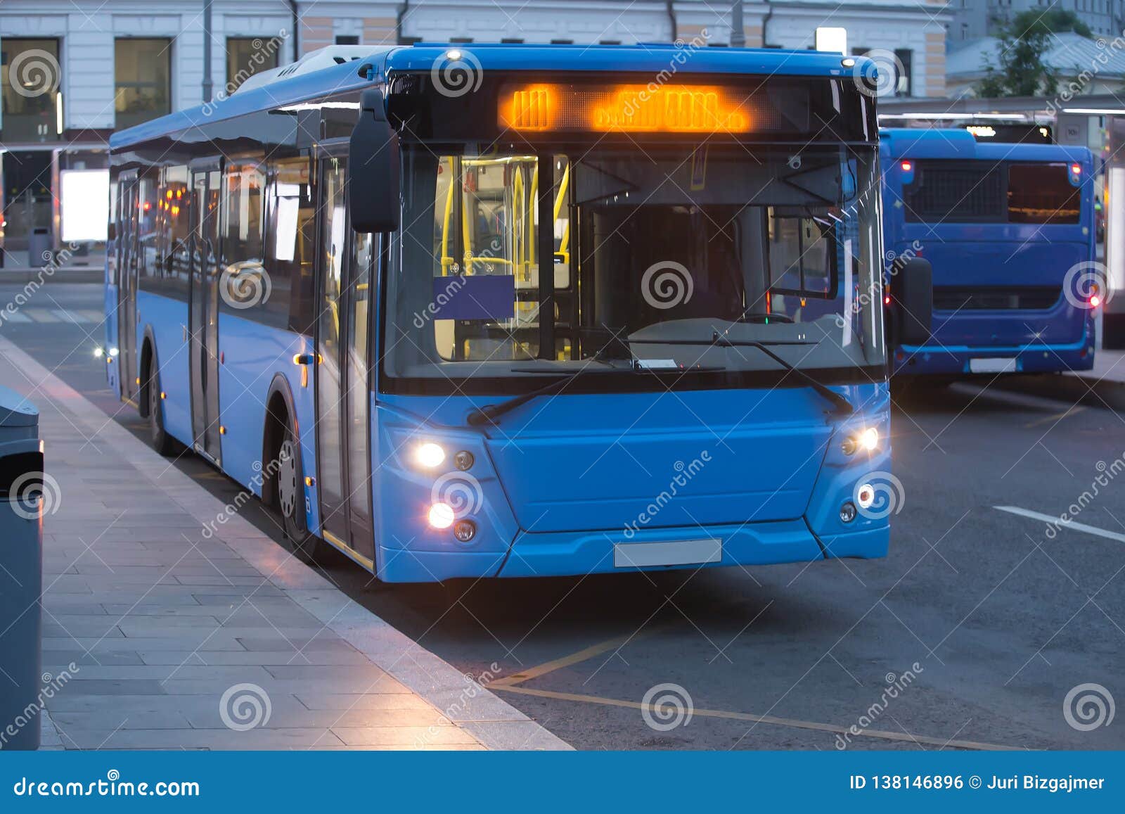Buses on the city street stock photo. Image of landmark - 138146896