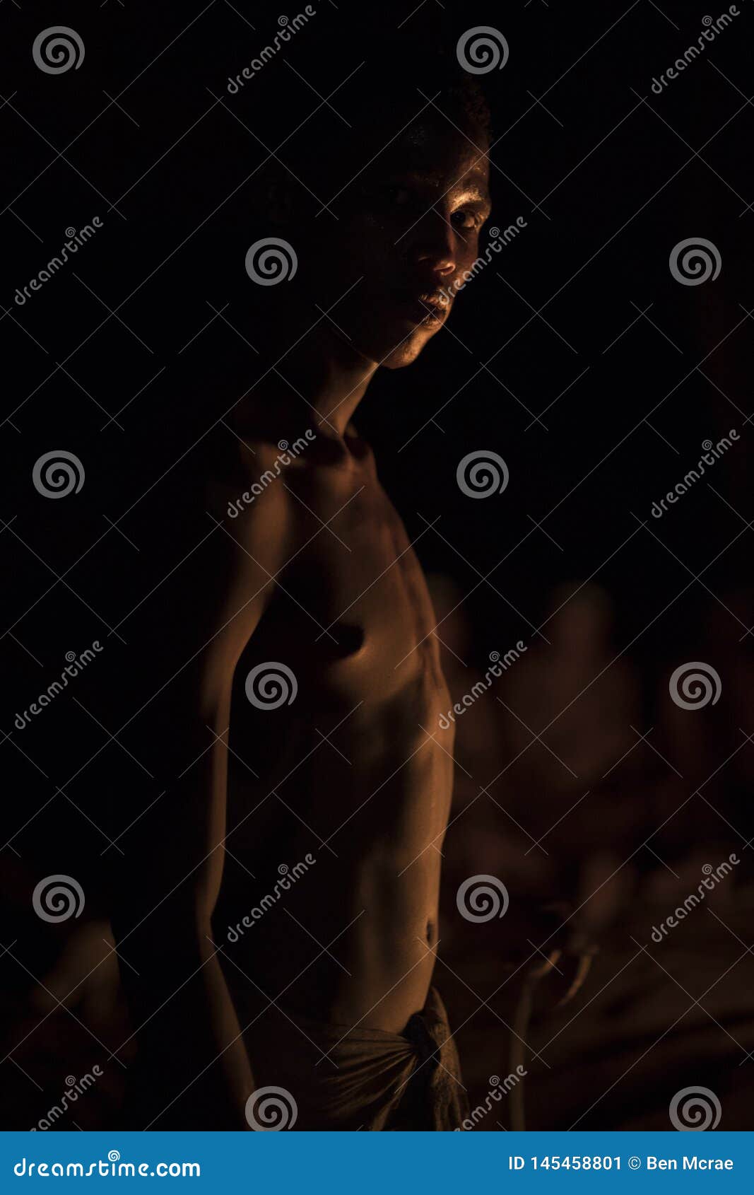 Bushman in fire light editorial photo. Image of boschjesmens - 145458801