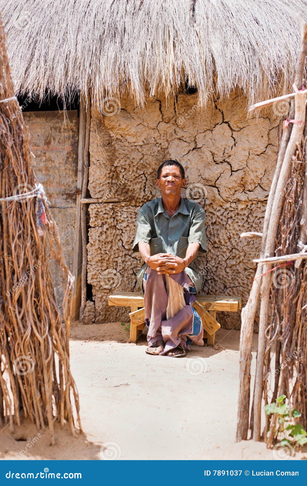 Bushman sitting in shade stock image. Image of clay, midday - 7891037