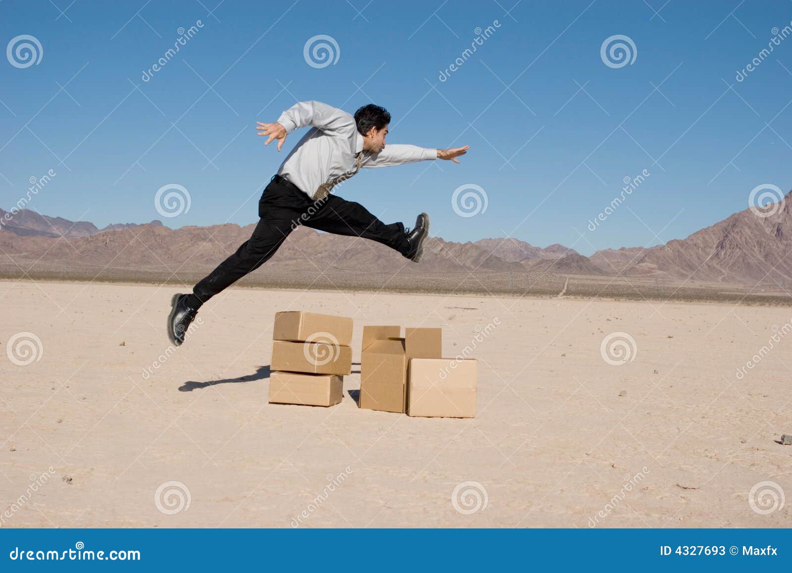Businesman Jumping Over Boxes Stock Image - Image of manager ...